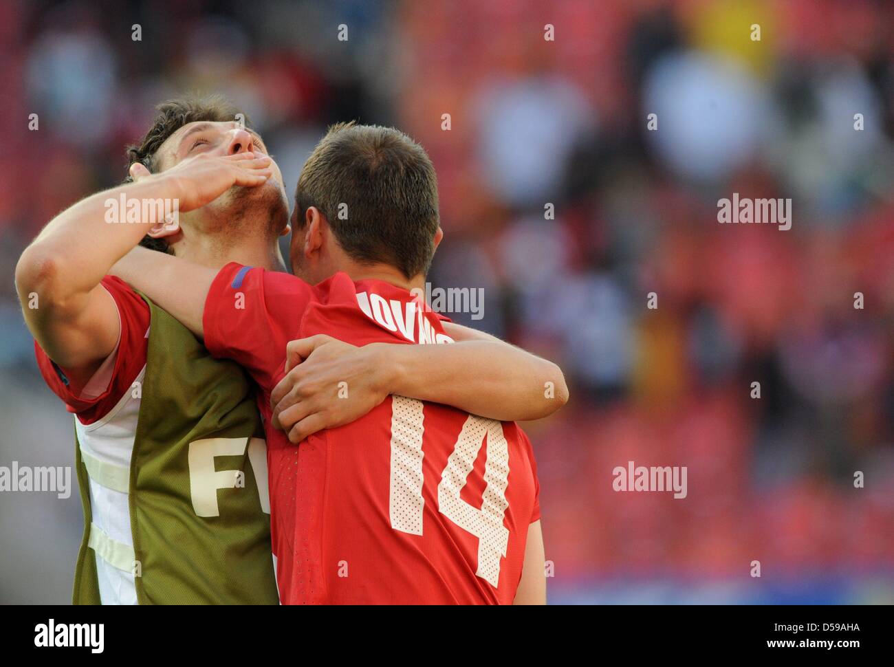 Serbia's goalscorer Milan Jovanovic (R) celebrates with an unidentified ...