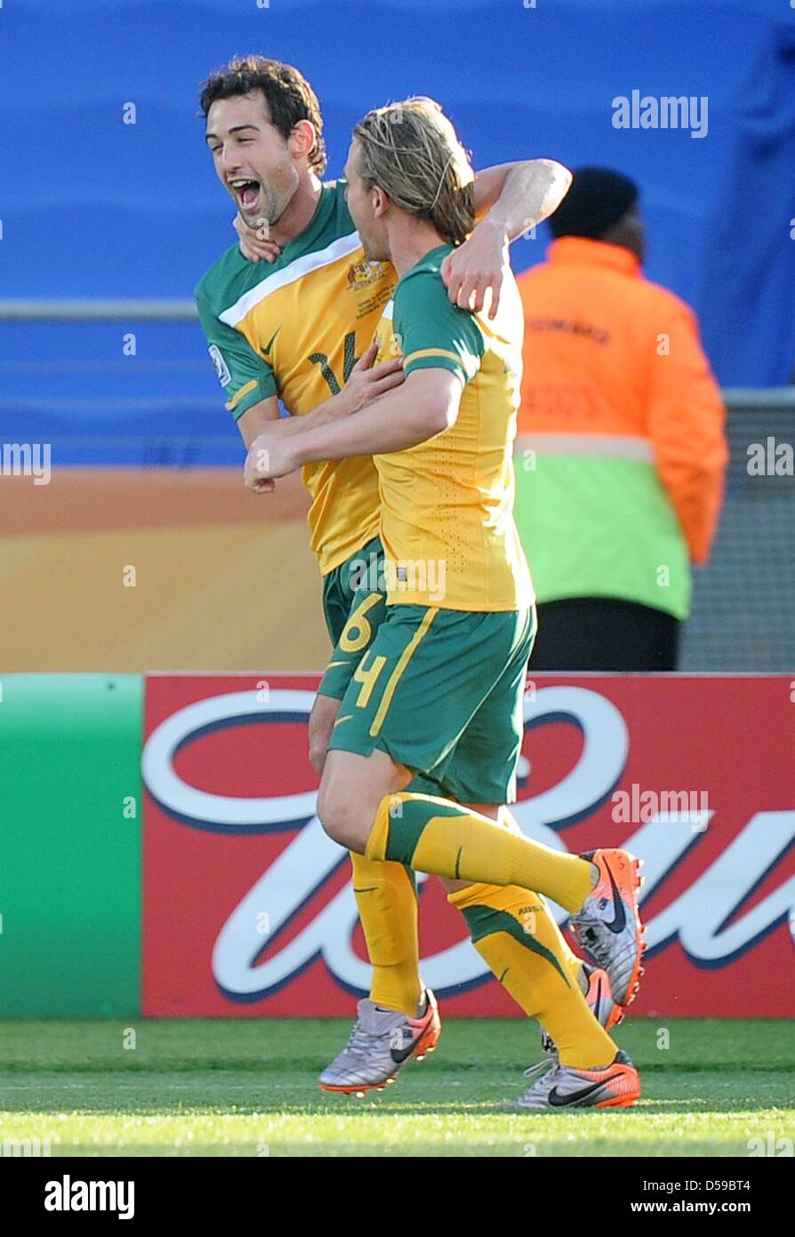 Brett Holman (R) of Australia celebrates with teammate Carl Valeri ...