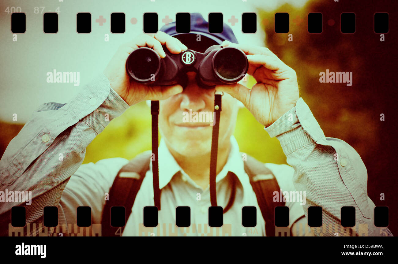 Man with binoculars Stock Photo - Alamy