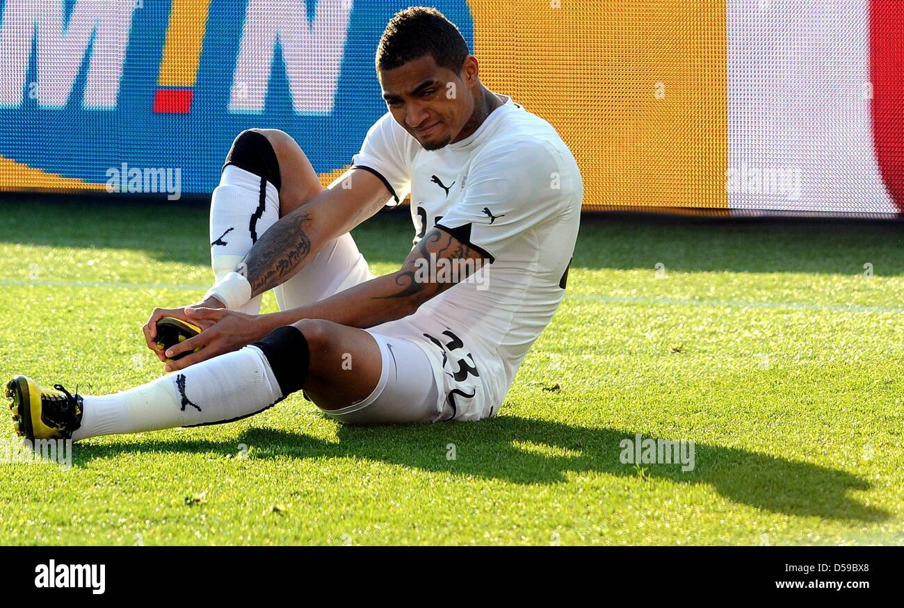 Kevin Prince Boateng of Ghana sits on the pitch during the FIFA World ...