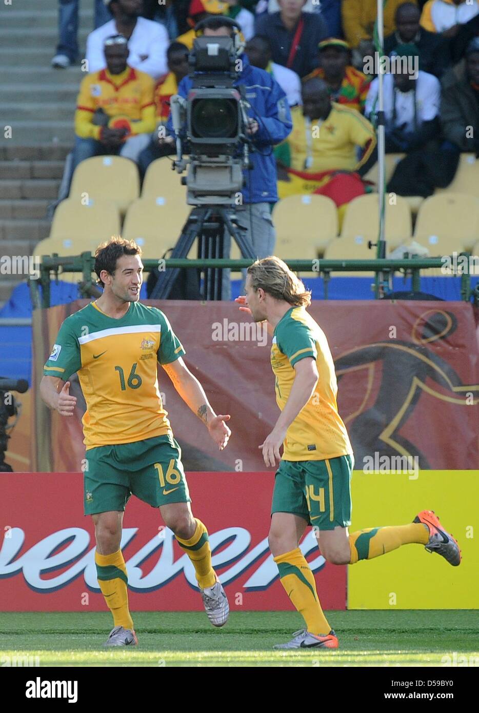 Brett Holman (R) of Australia celebrates with teammate Carl Valeri ...