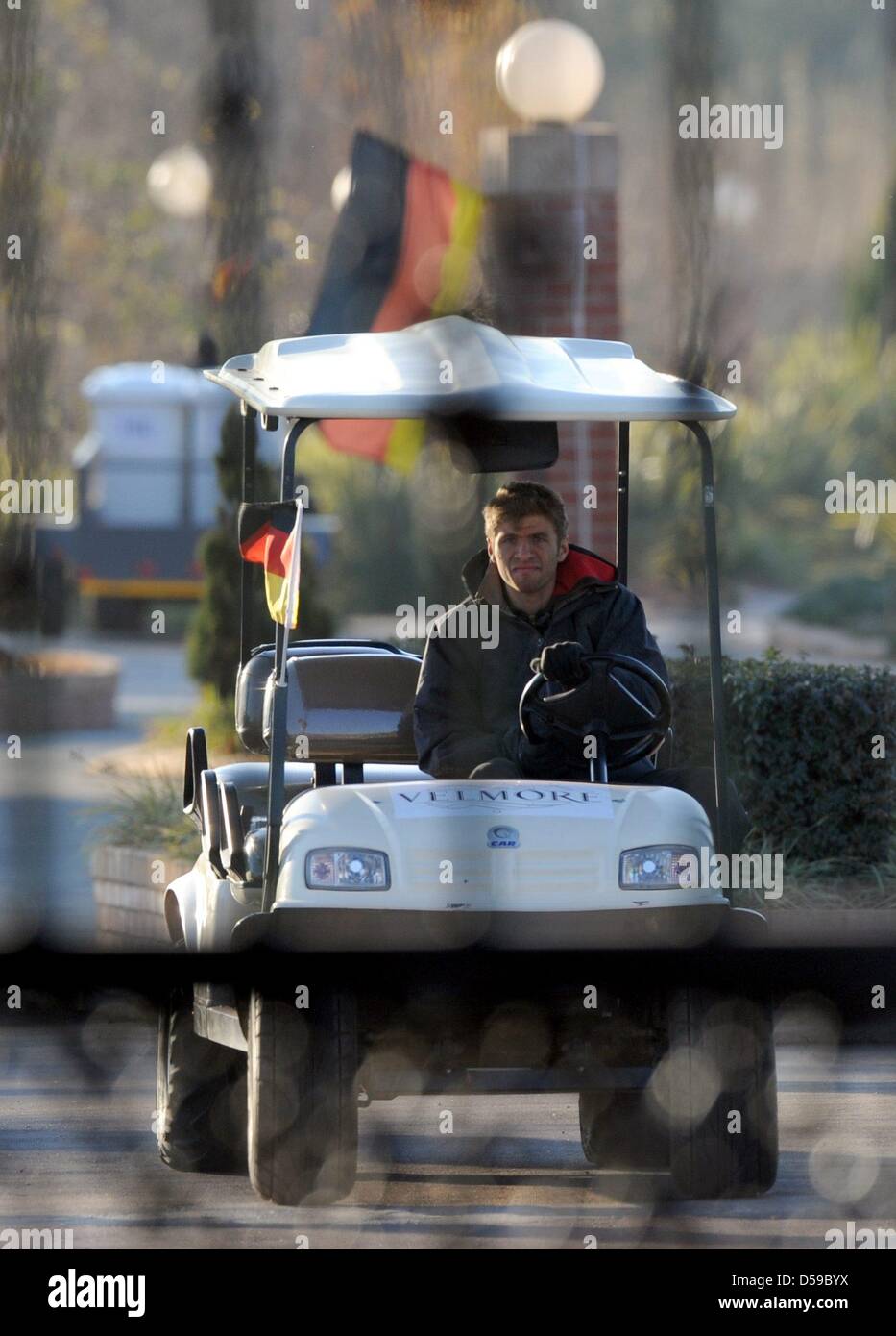 German player Thomas Mueller drives a golf cart at the Velmore Grand ...