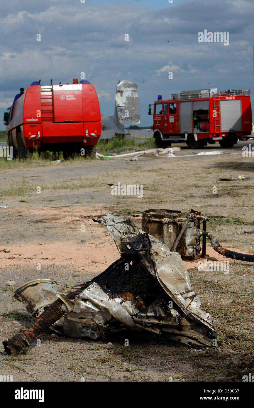Fire fighters examine a crashed Raisin Bomber, aka Candy Bomber on a ...