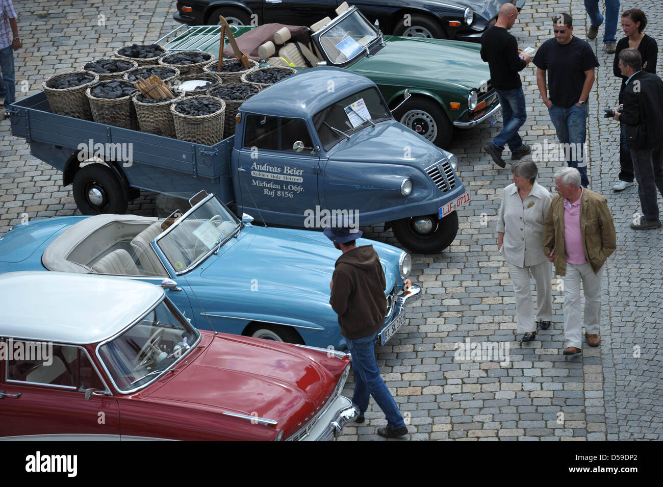 Visitors look at the classic cars during Southern Germany's biggest ...