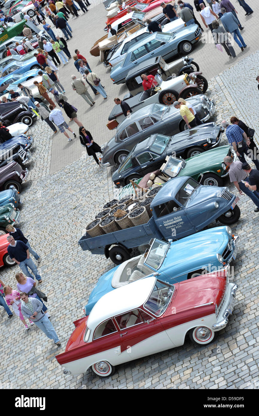 Visitors look at the classic cars during Southern Germany's biggest ...