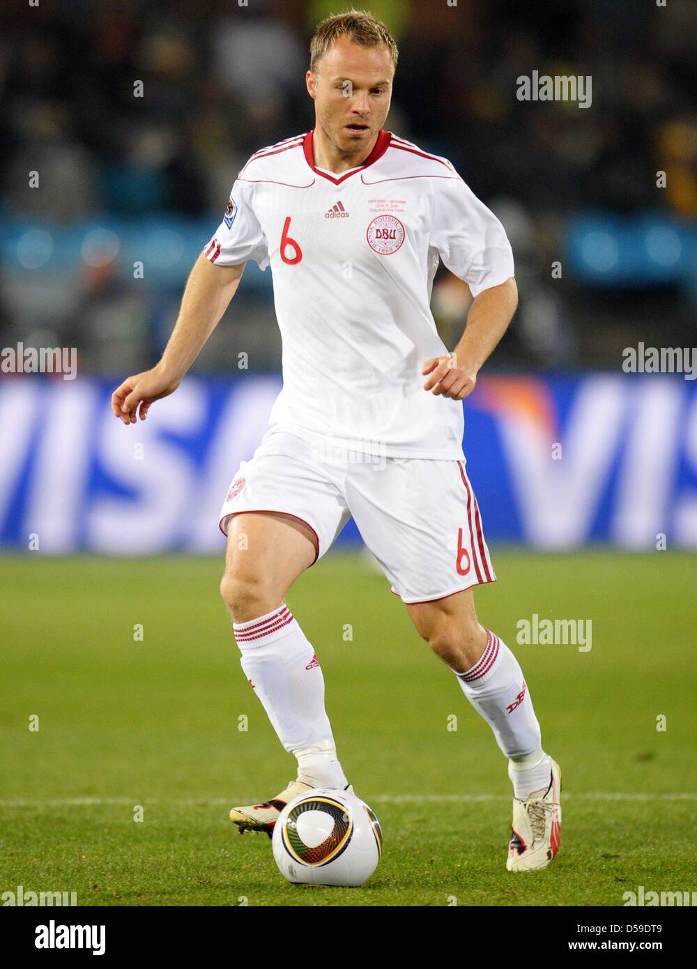 Lars Jacobsen of Denmark controls the ball during the FIFA World Cup ...