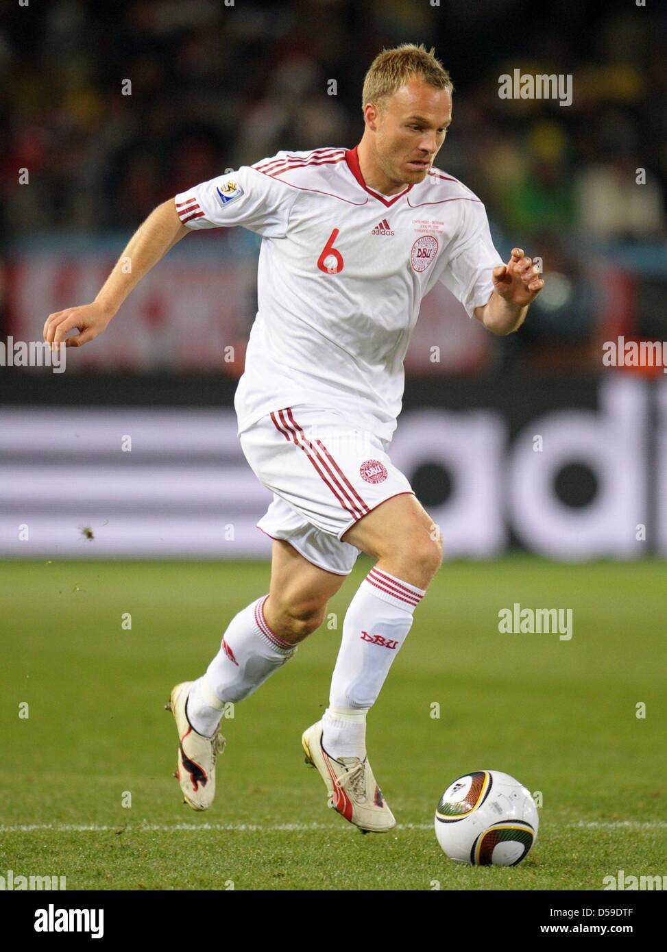 Lars Jacobsen of Denmark controls the ball during the FIFA World Cup ...