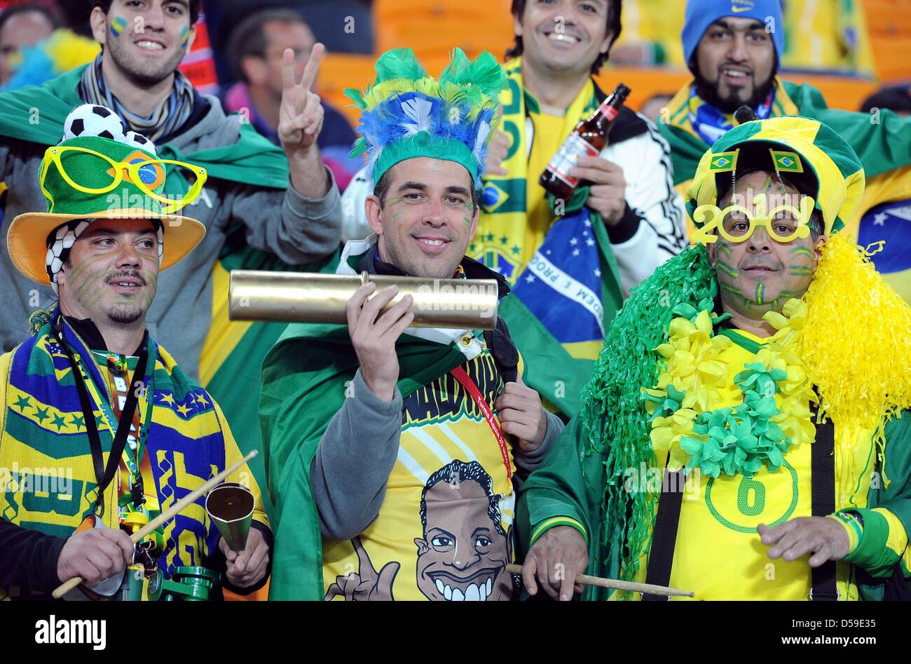 Brazilian fans celebrate on the stand prior to the 2010 FIFA World Cup ...