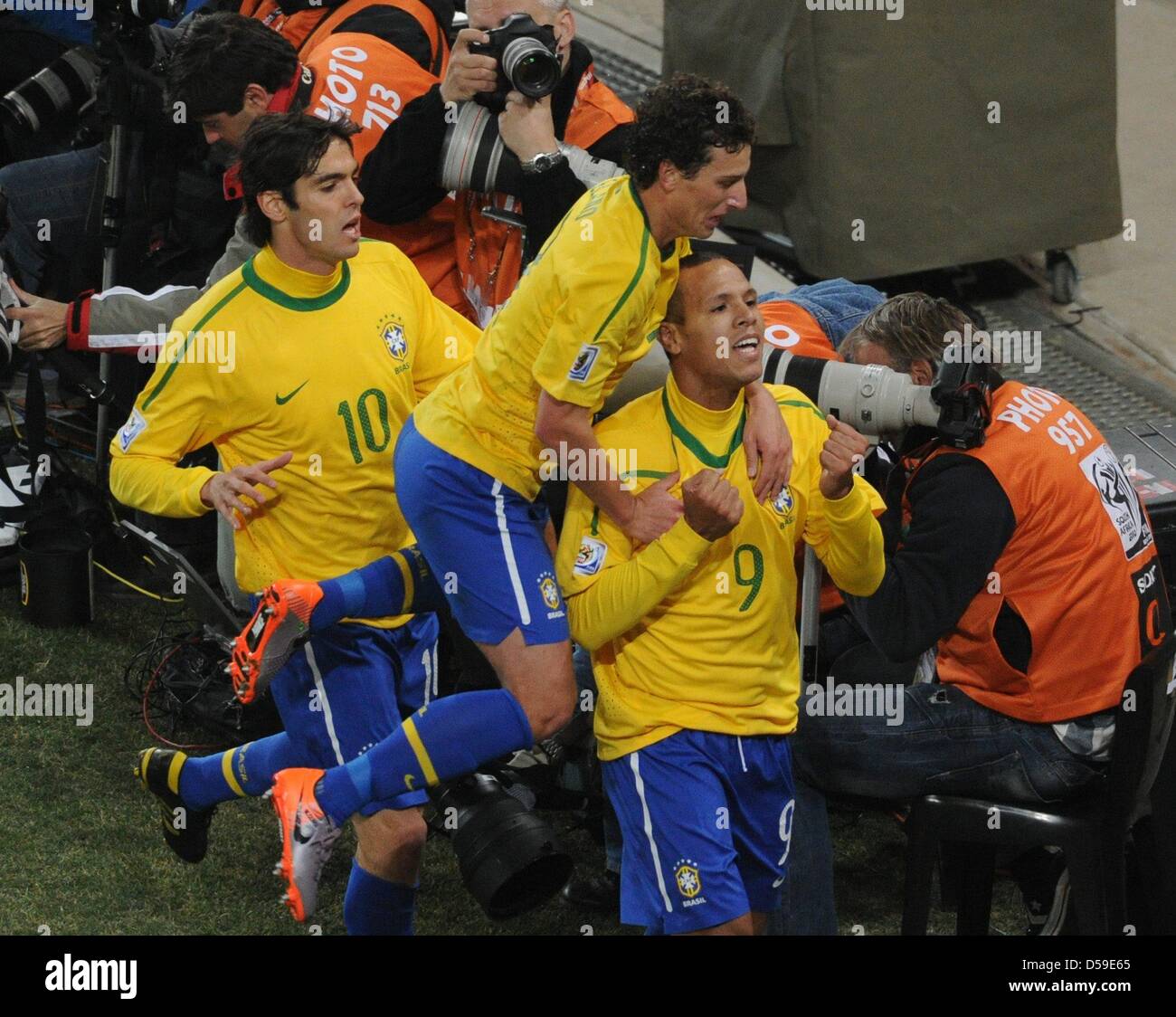 Brazil's Luis Fabiano (R) celebrates scoring the 1-0 with team mates ...