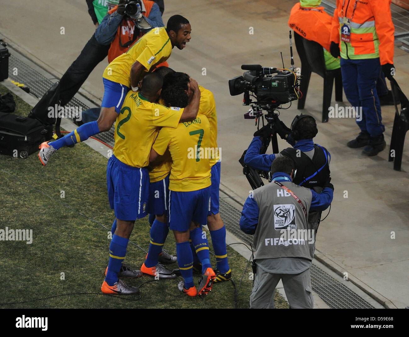 Brazil's Luis Fabiano (C, hidden) celebrates scoring the 1-0 with team ...