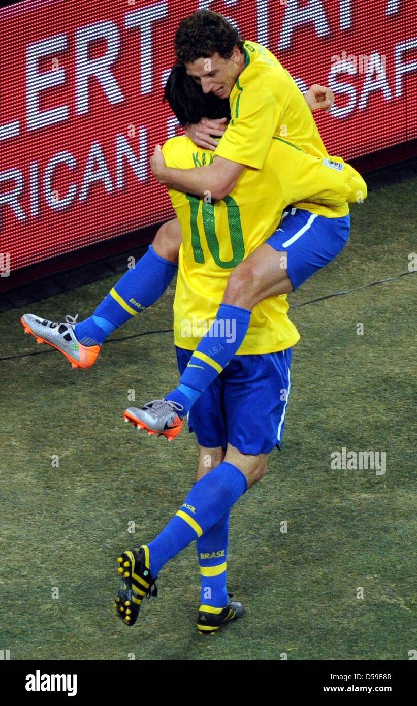 Brazil's Elano (R) celebrates scoring the 3-0 with team mate Kaka ...