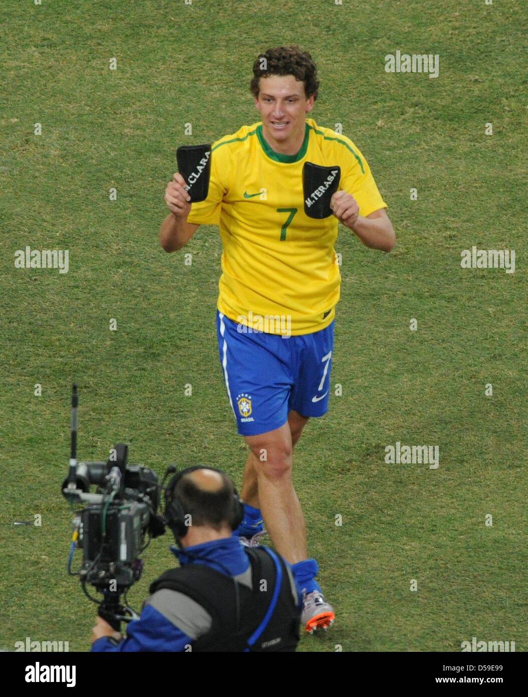 Brazil's Elano shows his shinpads as he celebrates scoring the 3-0 ...
