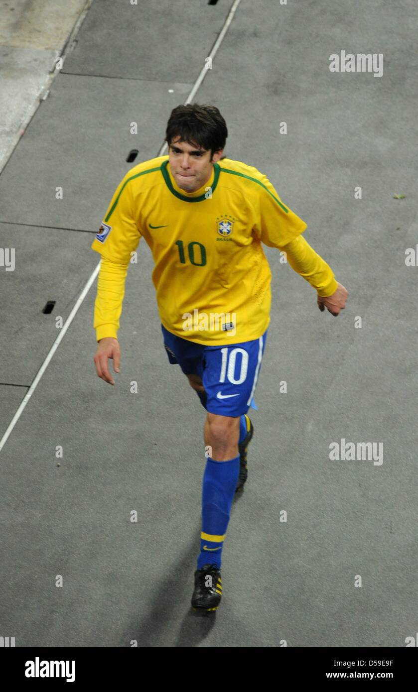 Brazil's Kaka leaves the pitch after being booked with the yellow-red ...