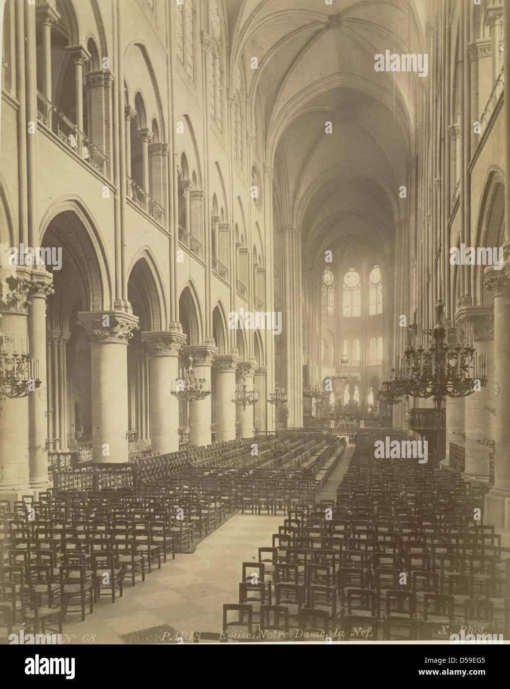A photograph of the nave inside Notre Dame Cathedral in Paris ...
