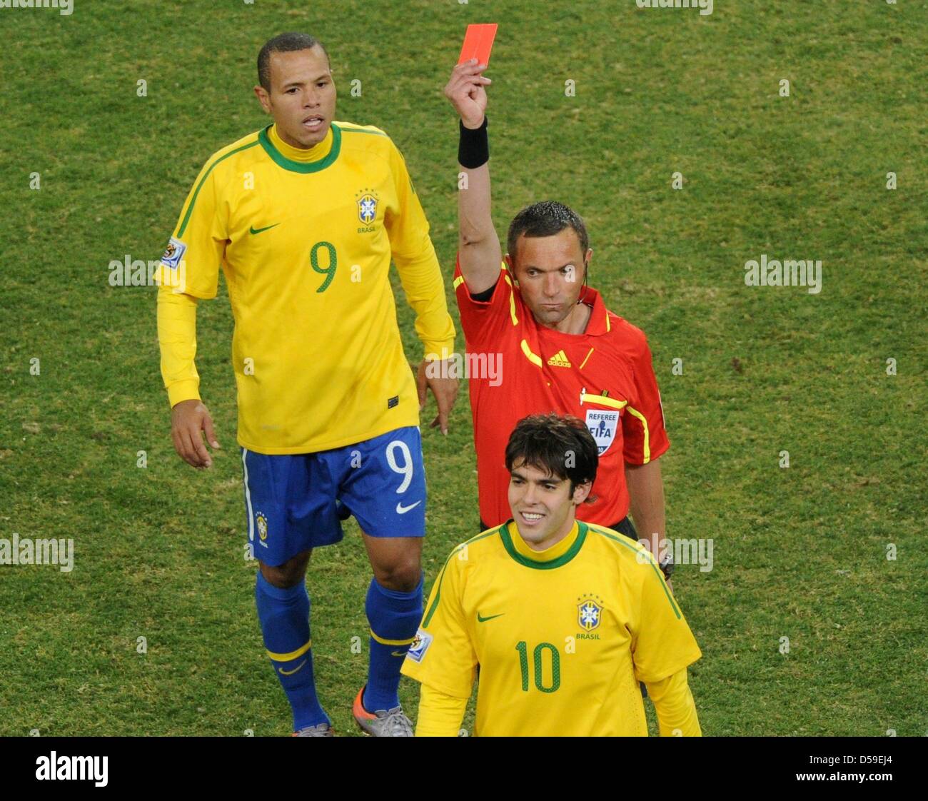 Brazil's Kaka leaves the pitch after being booked with the yellow-red ...
