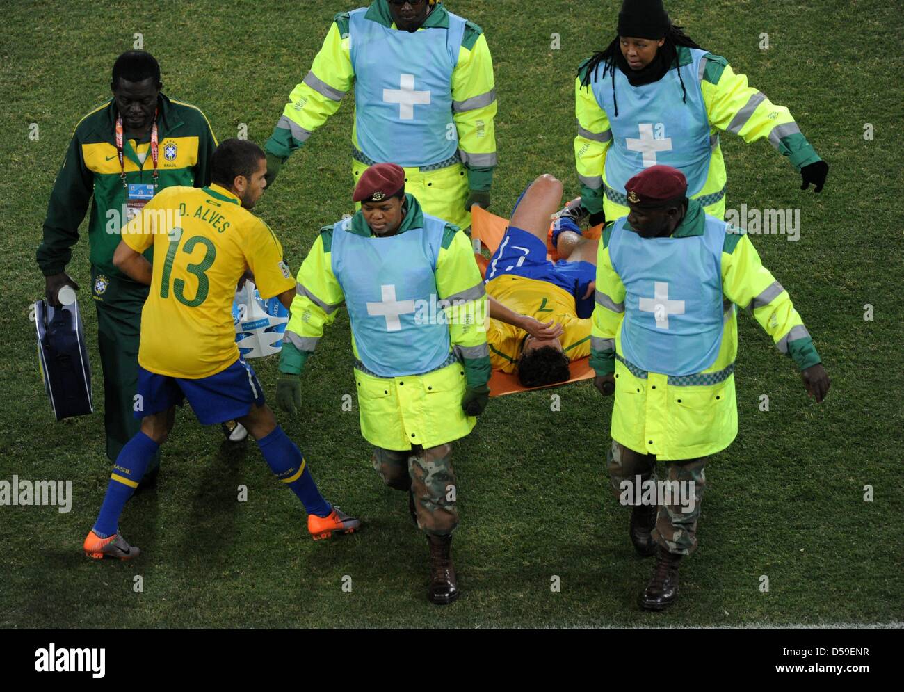Brazil's Elano is carried off the pitch on a stretcher during the 2010 ...