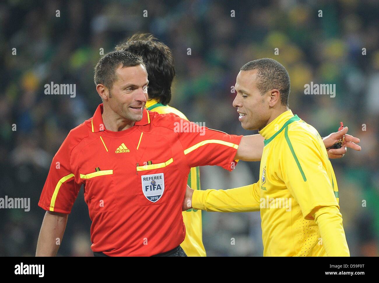 French referee Stephane Lannoy chats with Brazil's Luis Fabiano (R ...