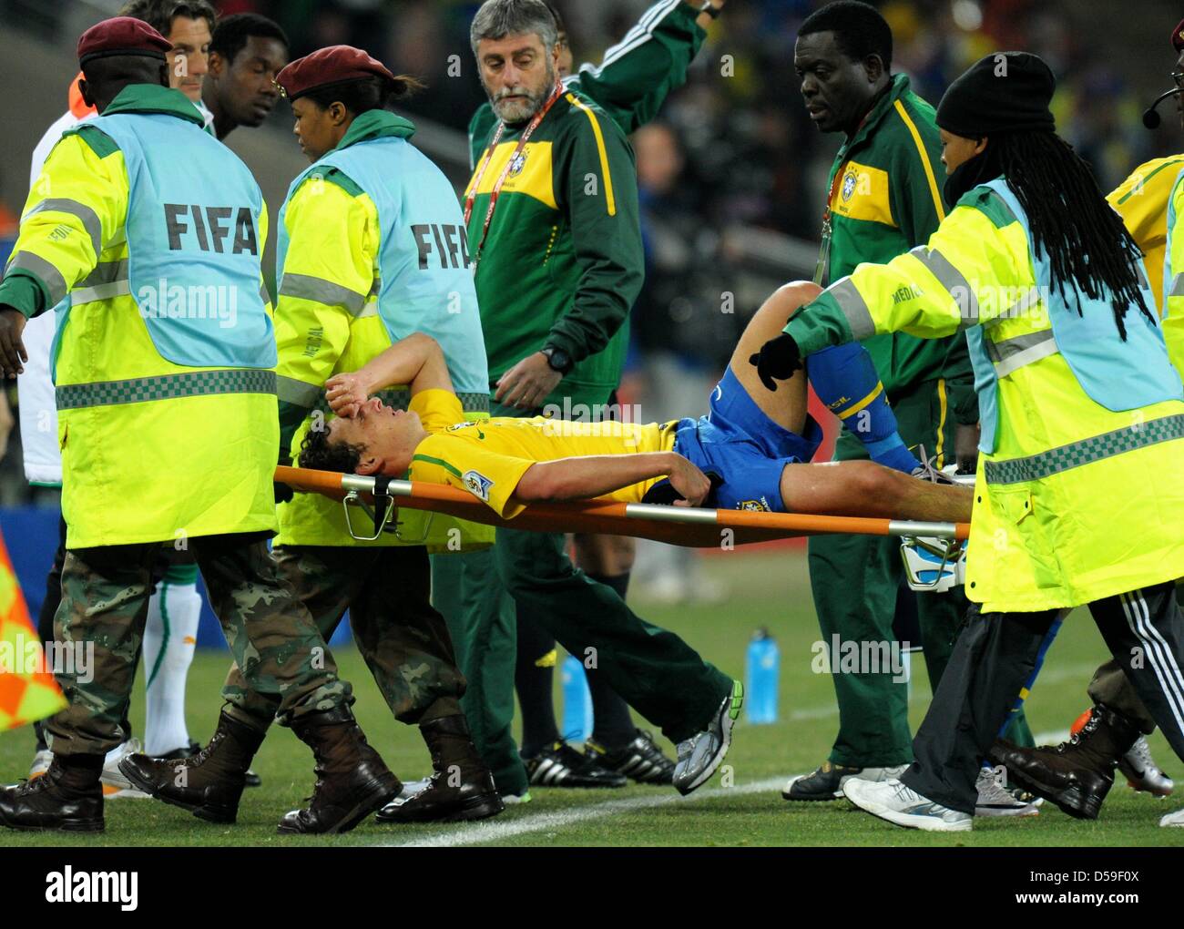 Elano of Brazil is being carried off pitch during the FIFA World Cup ...