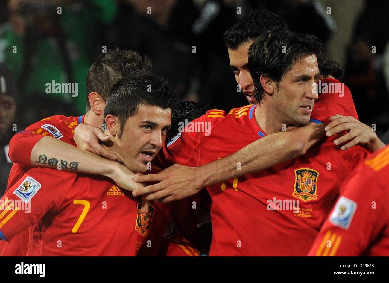 Spain's David Villa celebrates scoring the 1-0 with team mate Joan ...