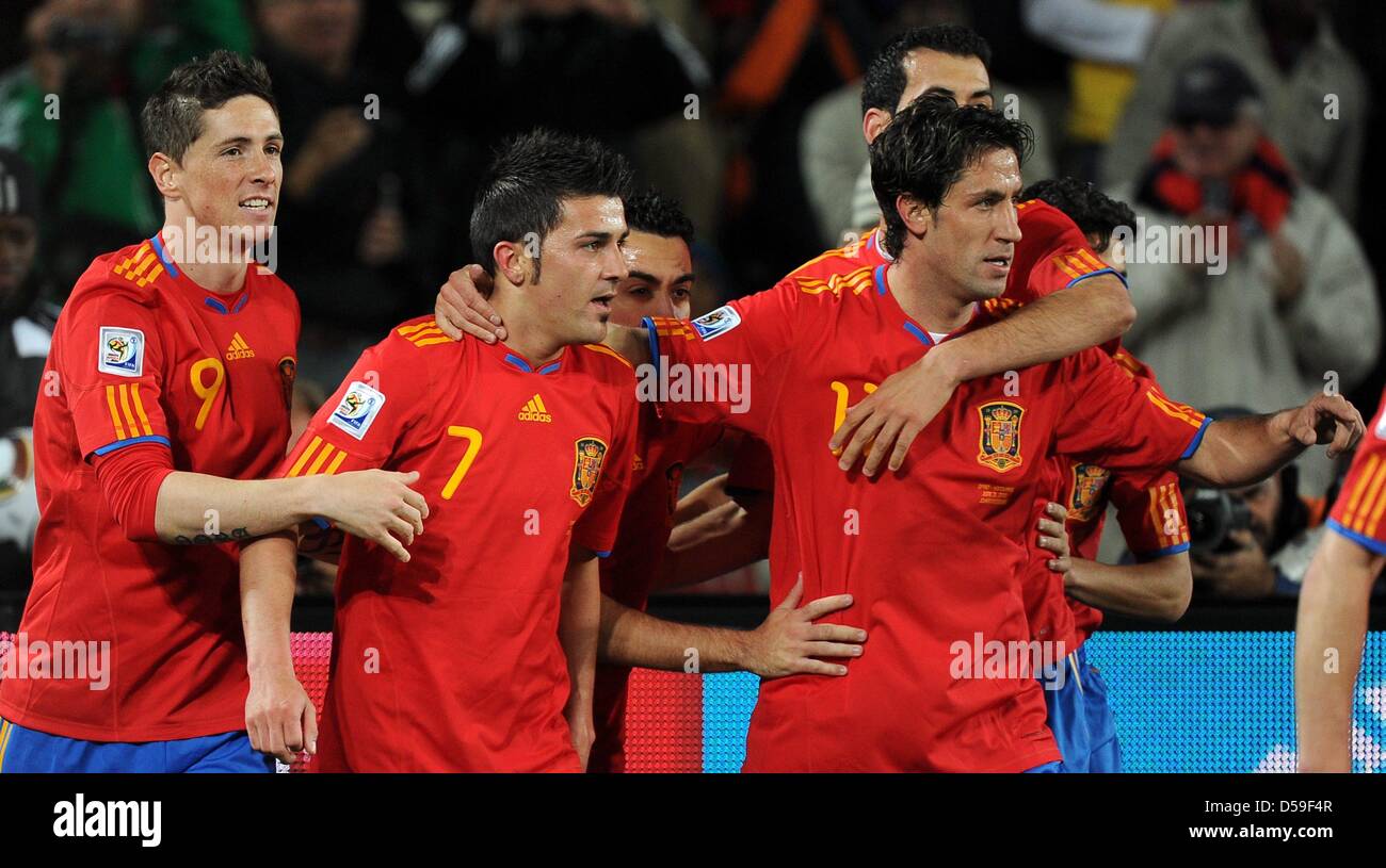 Spain's David Villa (7) celebrates scoring the 1-0 with teams Fernando ...