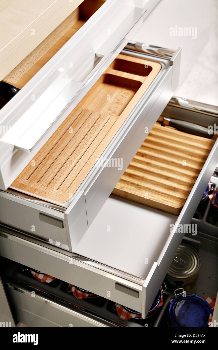 Modern kitchen drawers with compartments for various things Stock Photo ...