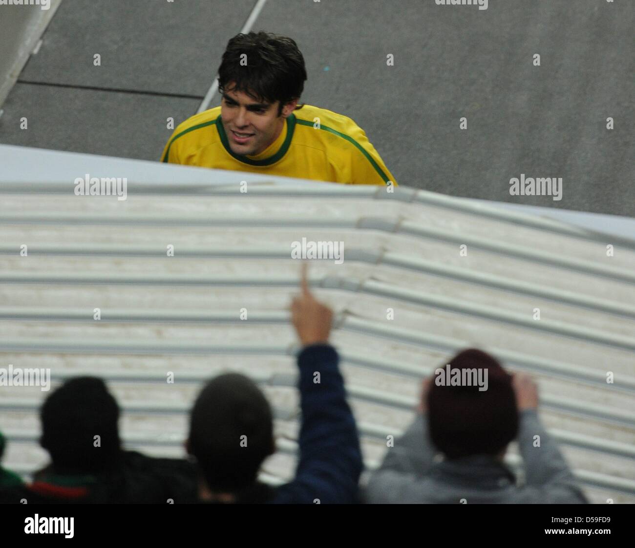 Brazil's Kaka leaves the pitch after being booked with the yellow-red ...