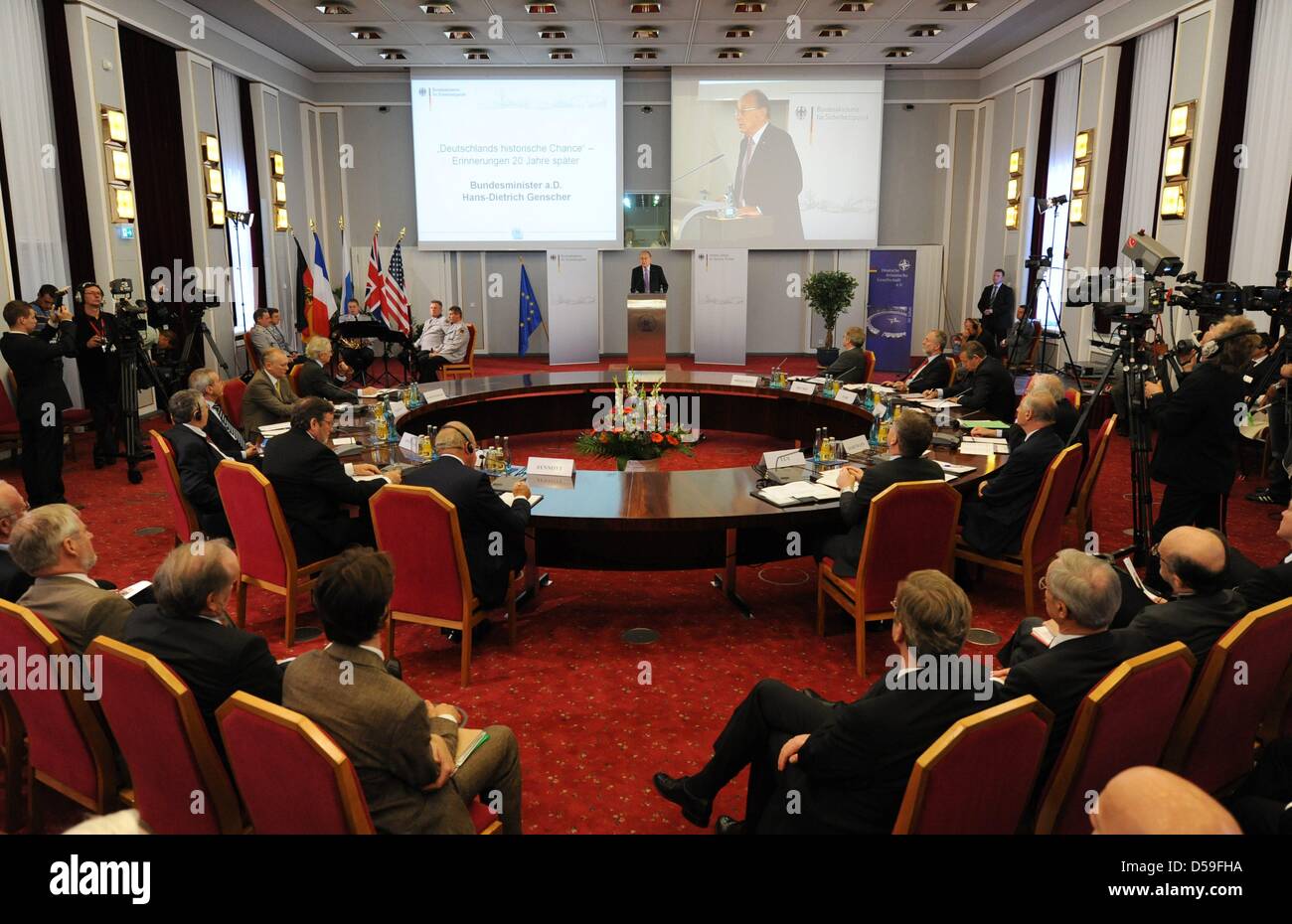 In front of the original negotiating table, former German Foreign ...