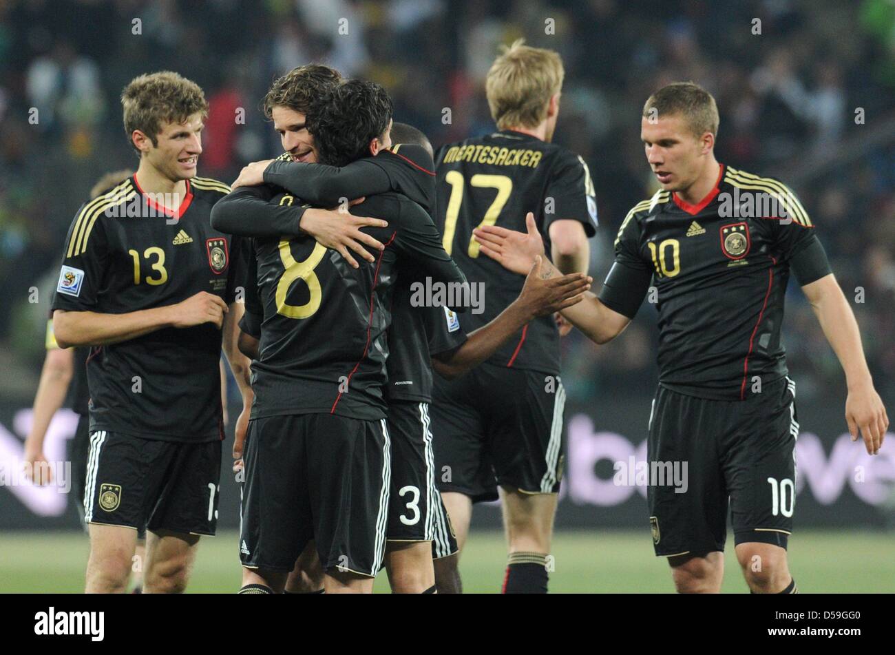 Mesut Oezil (3-L) of Germany celebrates with Thomas Mueller (L-R), Arne ...