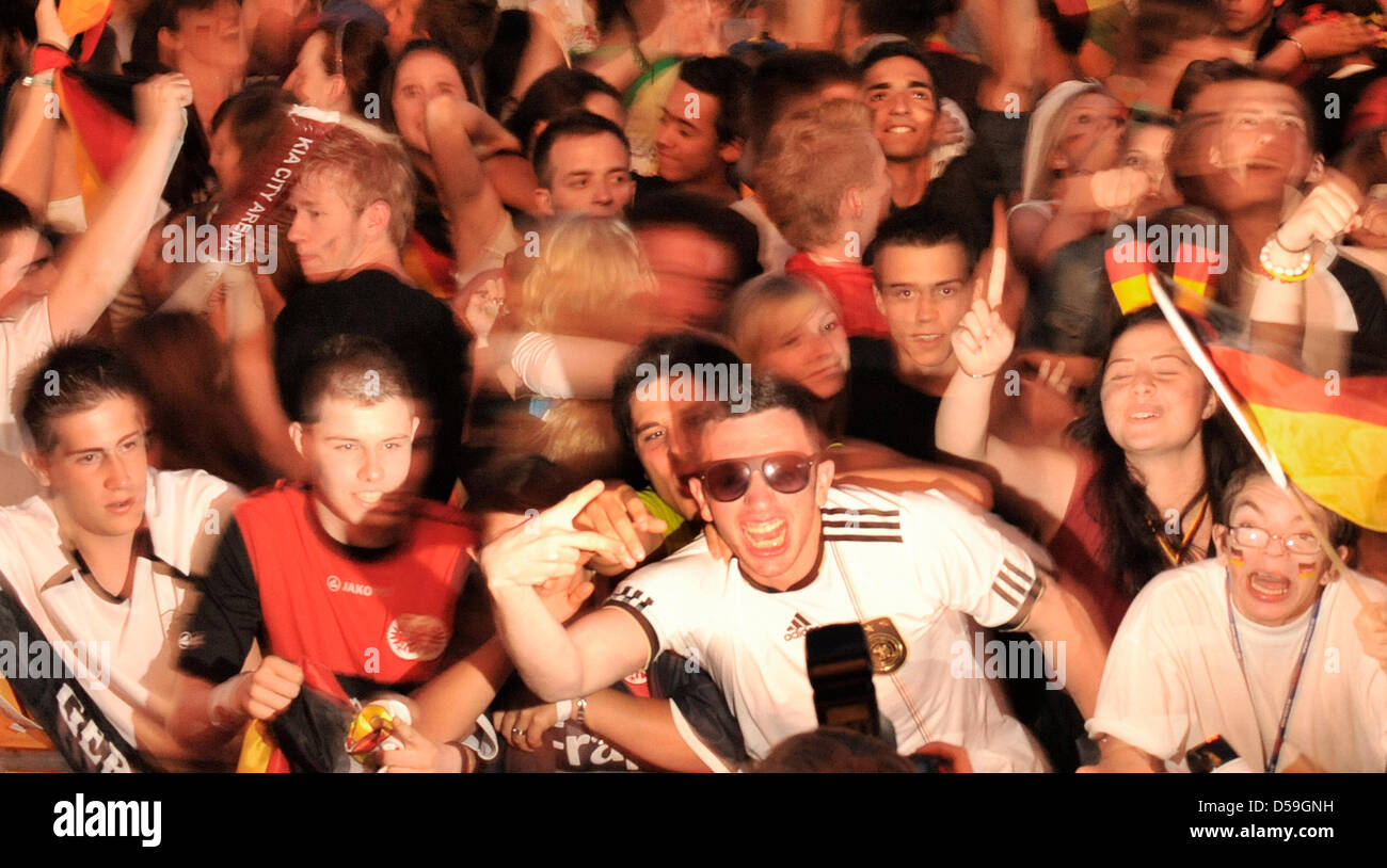 Fans celebrate the German national soccer team during an open screening ...