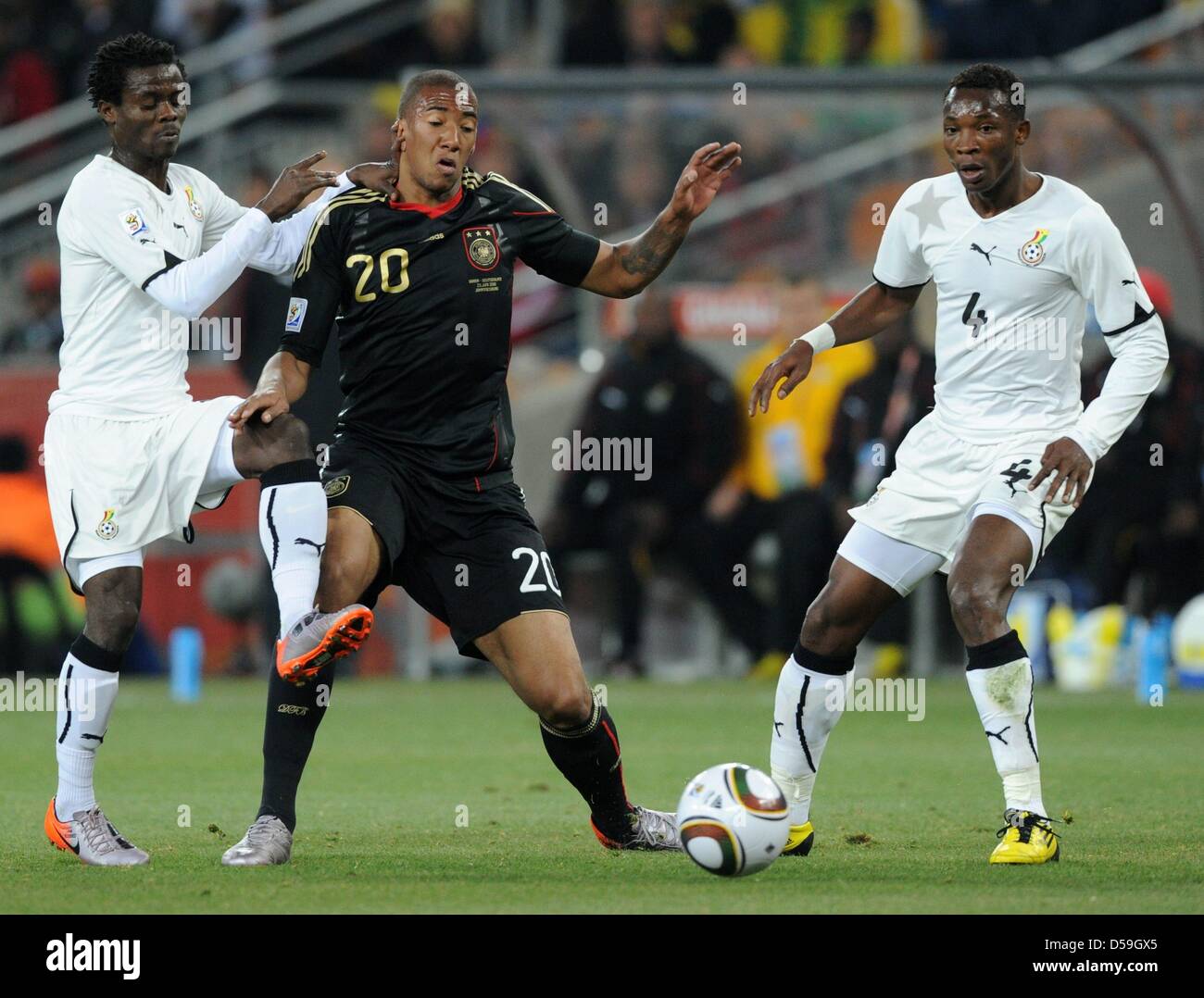 Germany's Jerome Boateng (C) and Ghana's Anthony Annan (L) and John ...