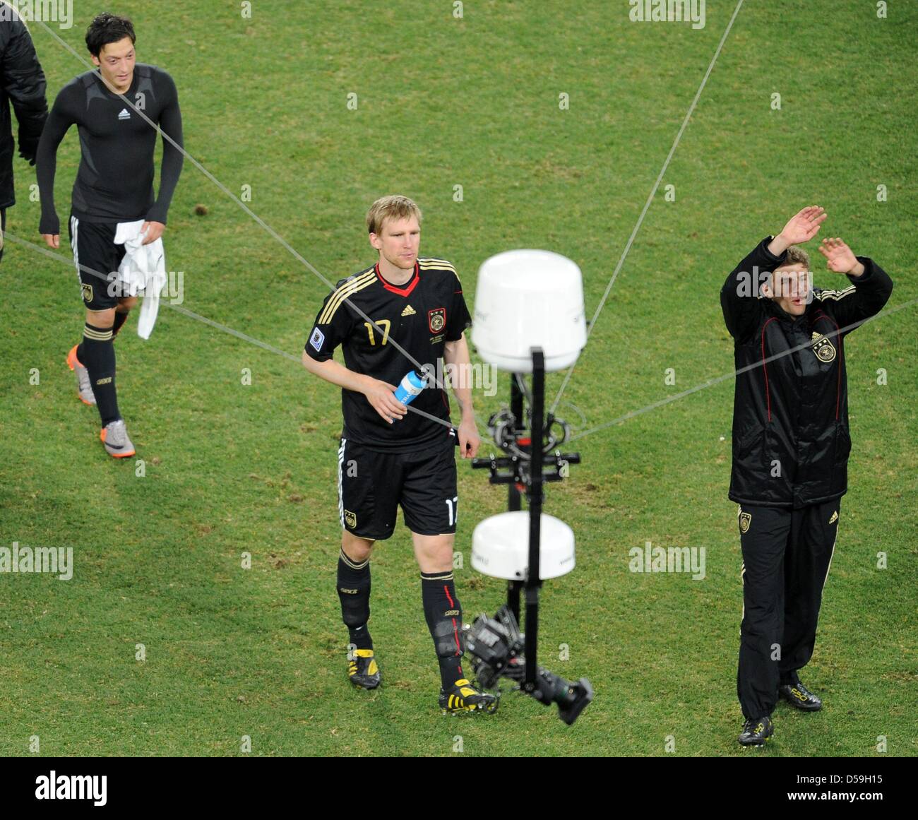 Germany's Mesut Oezil (L-R), Per Mertesacker and Thomas Mueller ...