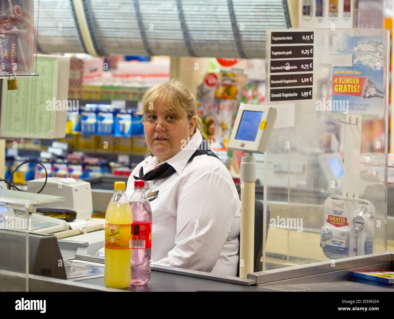 Cashier Barbara Emmely works again at a supermarket's cashier desk in ...