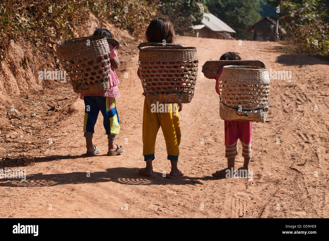 Akha girls and their bamboo baskets, Muang Singh, Laos Stock Photo - Alamy