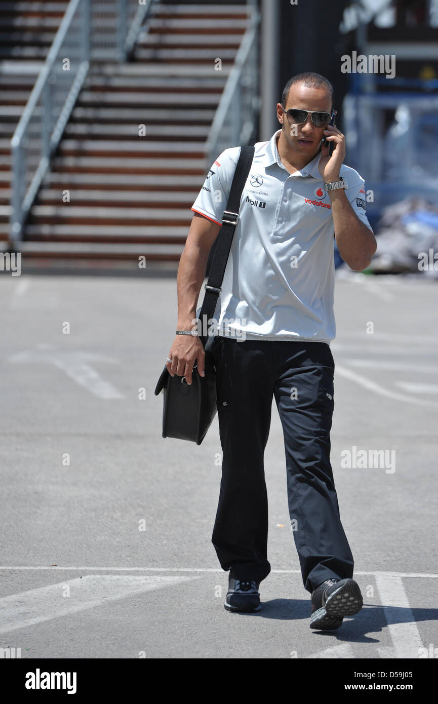 Lewis hamilton arrives in the paddock hi-res stock photography and ...