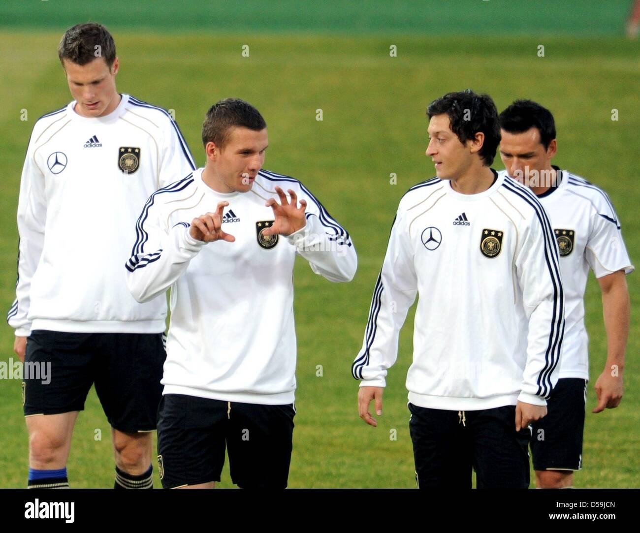 German players Marcell Jansen (L-R), Lukas Podolski, Mesut Oezil and ...