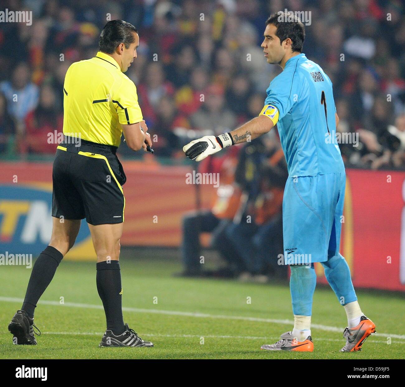 Chile's goalkeeper Claudio Bravo gestures towards Mexican referee Marco ...
