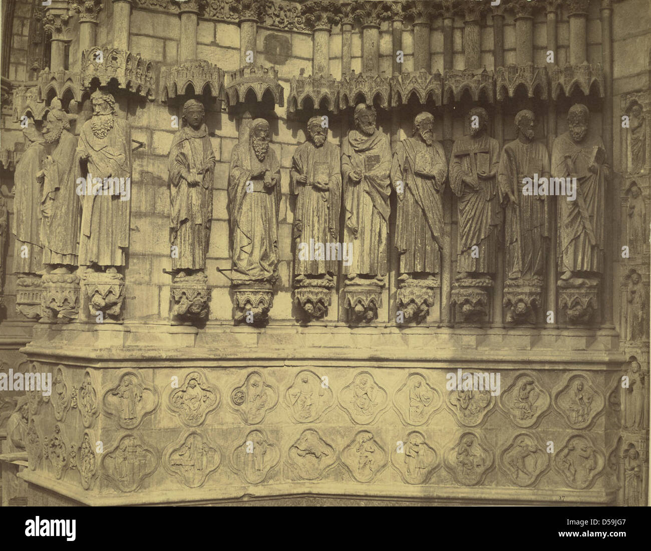 A close-up photograph showing statues of the Apostles in the embrasures ...