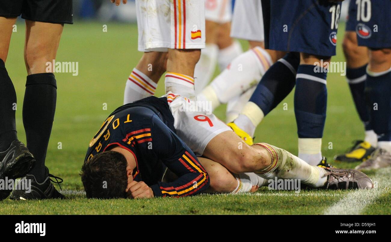 Spain's Fernando Torres lies injured on the pitch during the 2010 FIFA ...