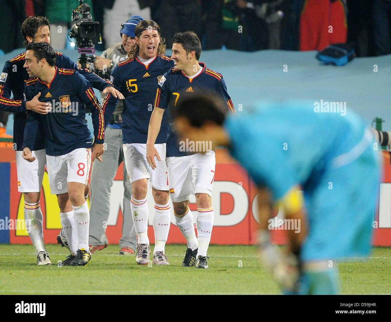 Spain's David Villa (R) celebrates scoring the 1-0 with team mates Joan ...