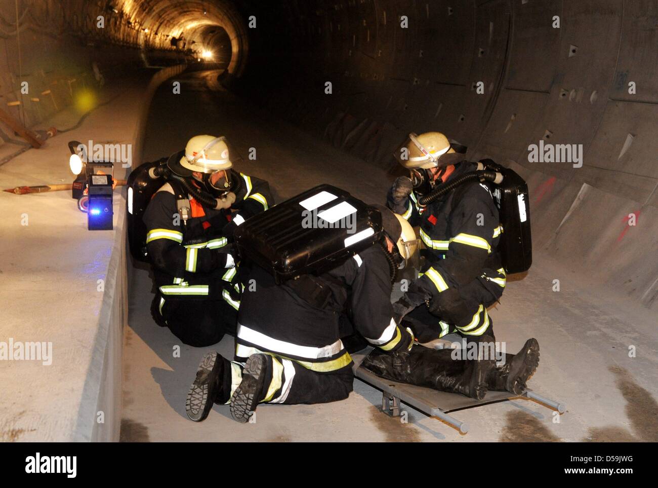 Firemen practise in an underground tunnel that is still under ...