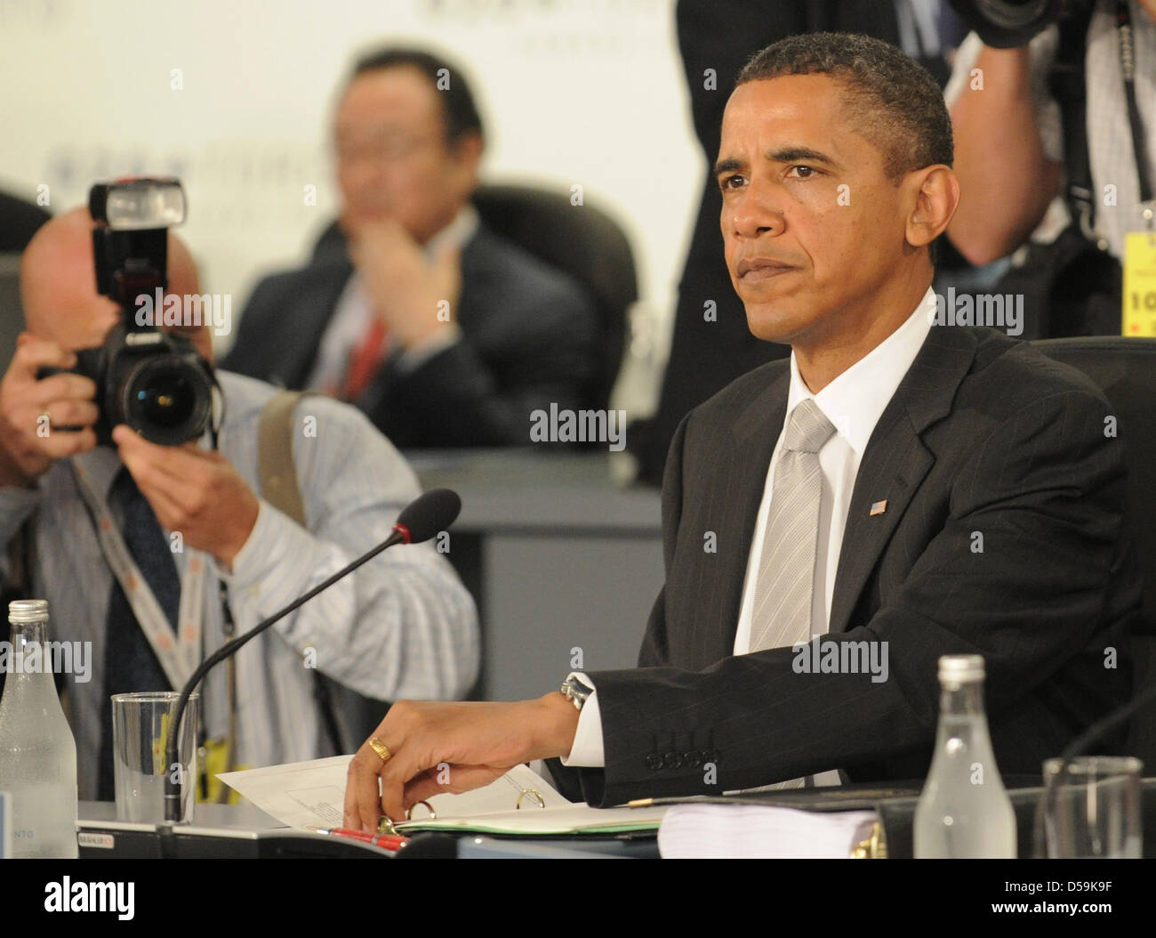 The President of the United States Barack Obama takes his place at the ...