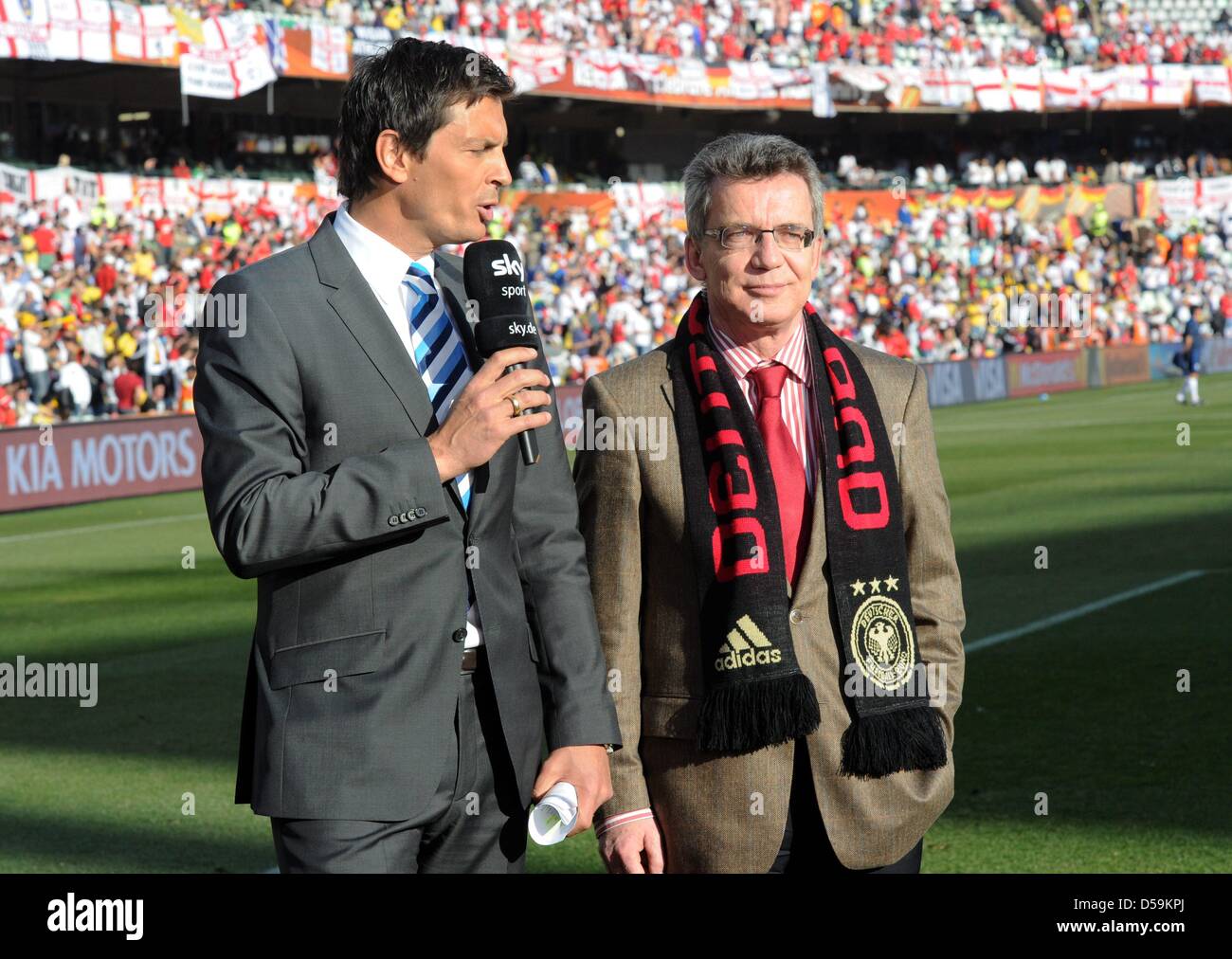German Interior Minister Thomas de Maiziere (R) during an interview ...
