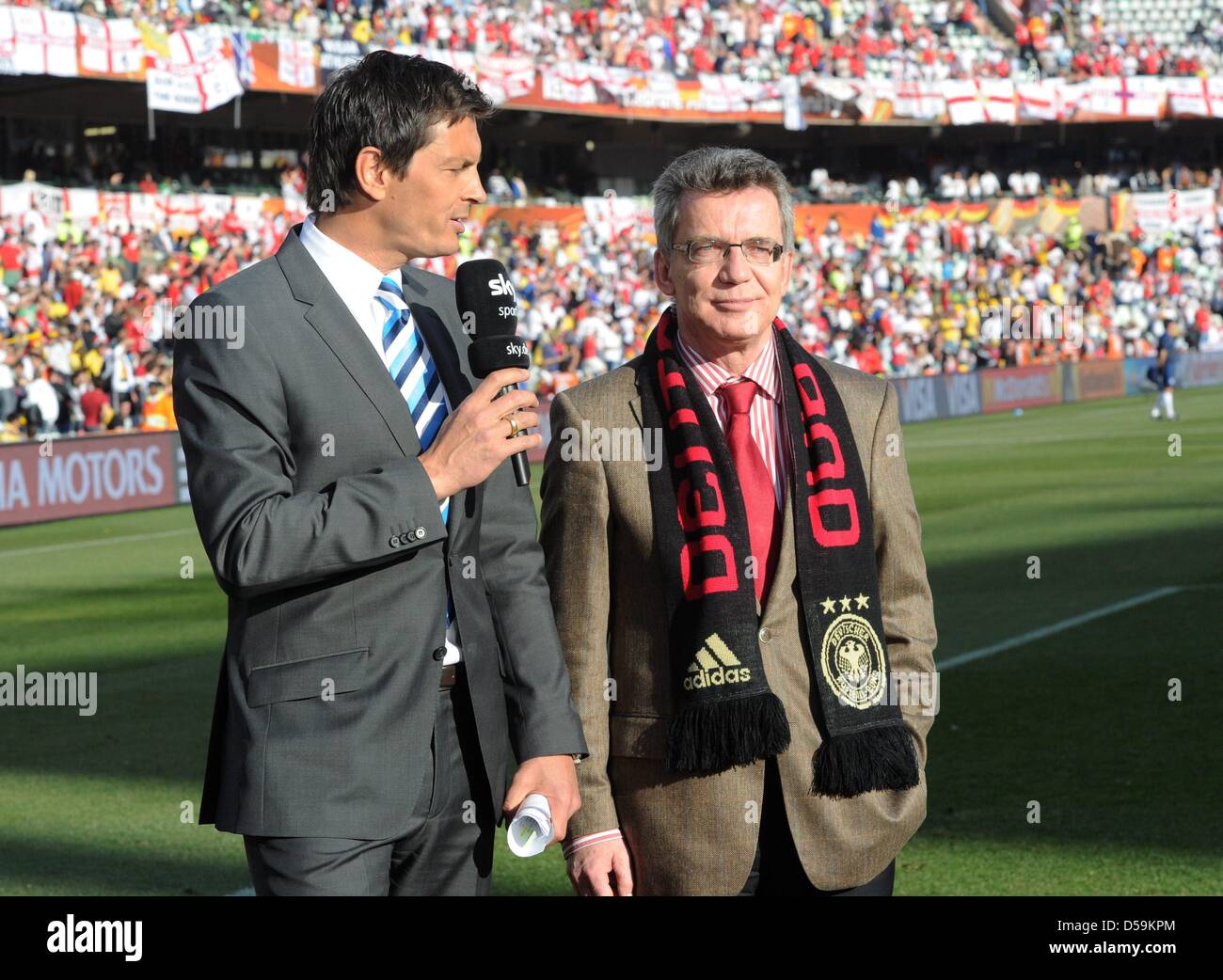 German Interior Minister Thomas de Maiziere (R) during an interview ...