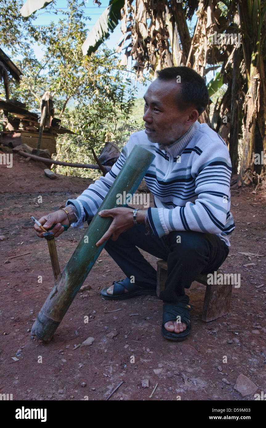 Hmong man and his bong water pipe, Luang Prabang, Laos Stock Photo - Alamy