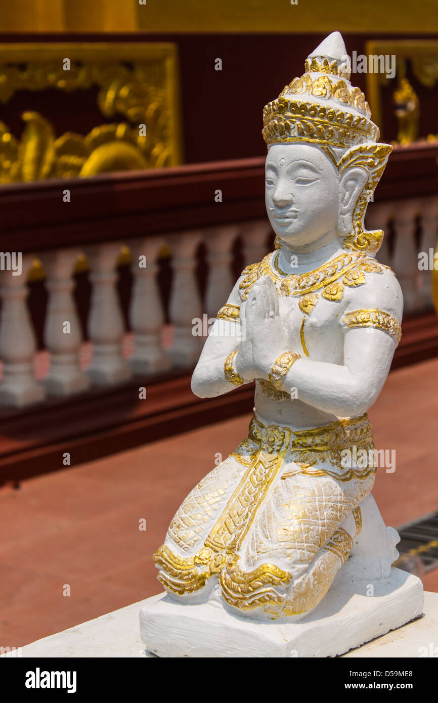 Sitting deva statue Stock Photo - Alamy