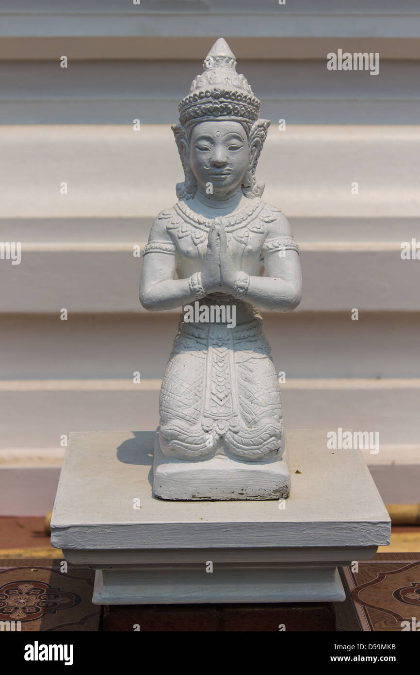 Sitting deva statue Stock Photo - Alamy
