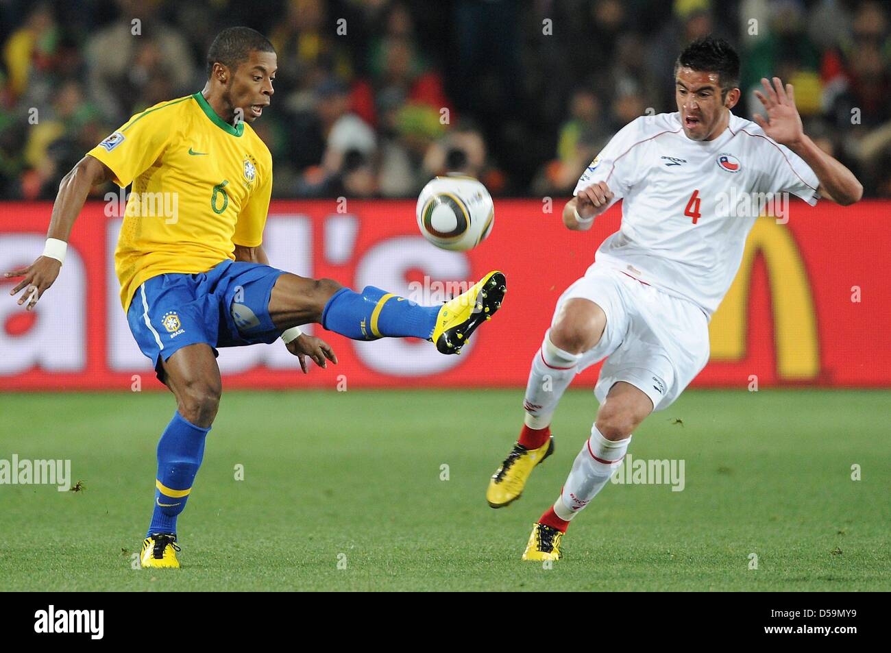 Brazil's Michel Bastos (L) vies for the ball with Chile's Mauricio Isla ...