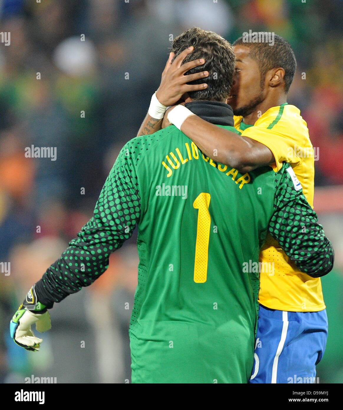 Brazil's goalkeeper Julio Cesar celebrates with team mate Michel Bastos ...