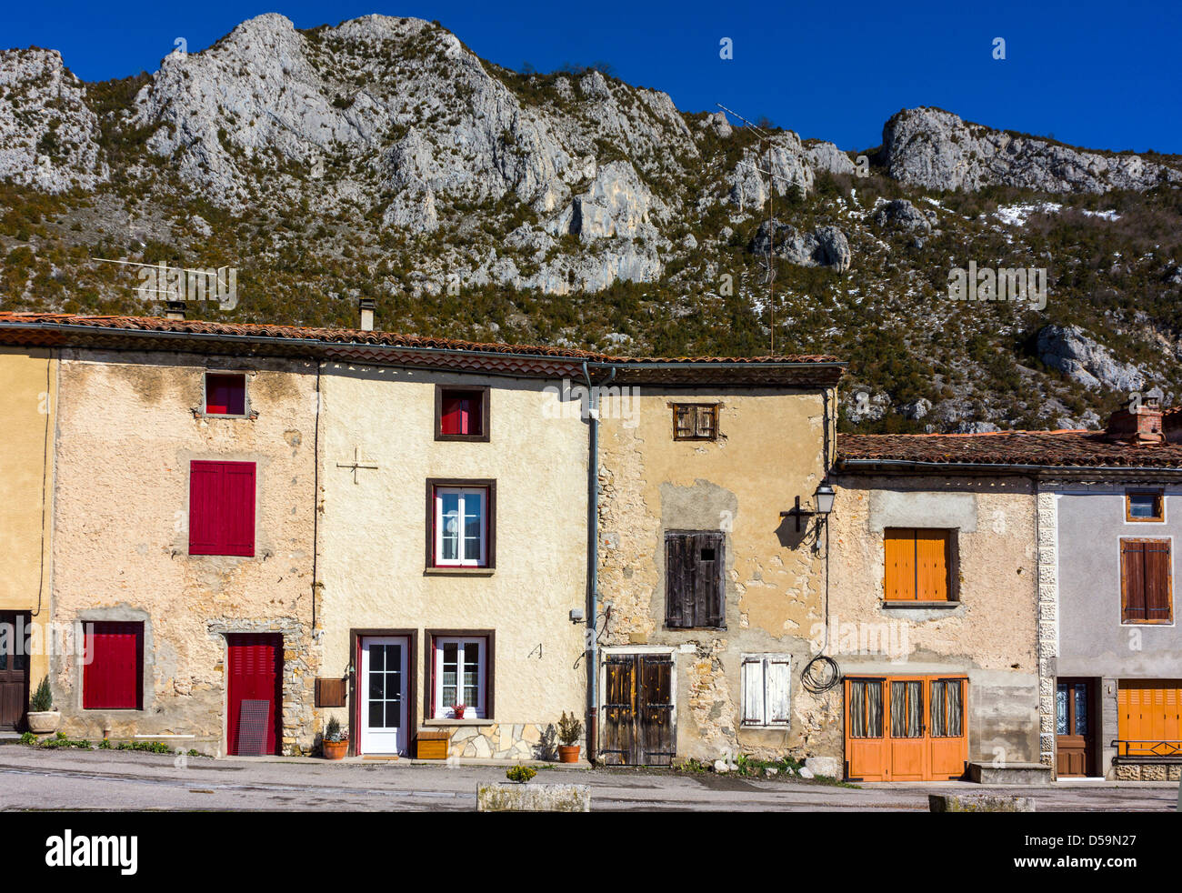 Old French houses terrace with mountains behind Stock Photo - Alamy