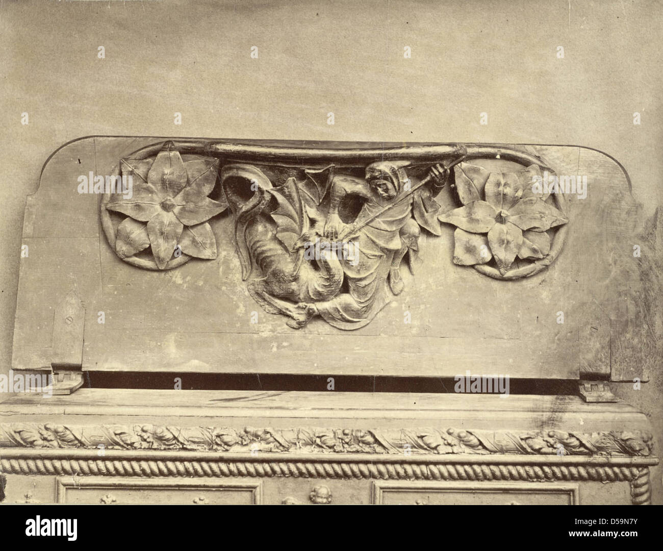 This image features a misericord from the choir of Wells Cathedral in ...